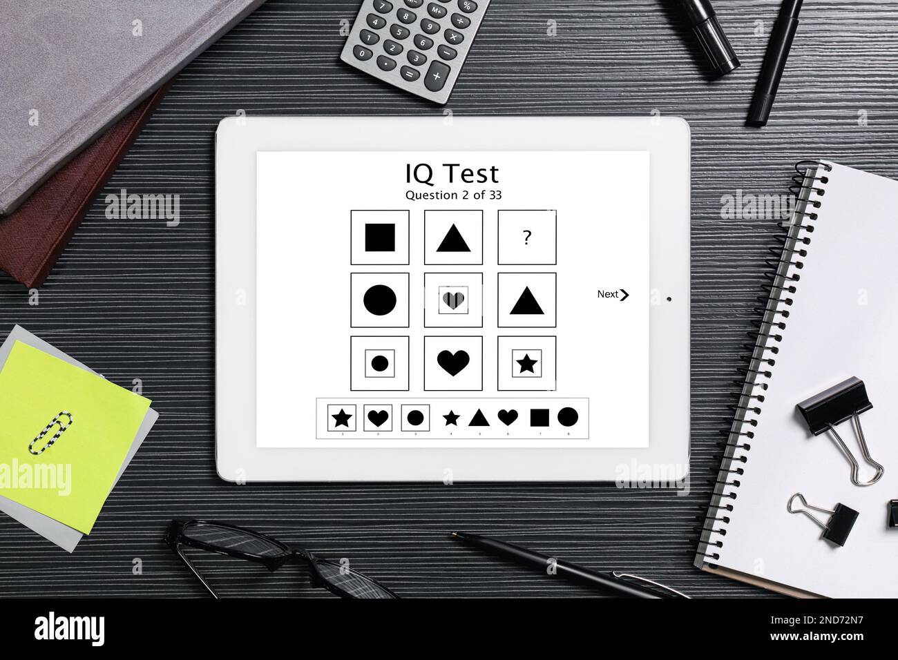 Modern tablet with IQ test on black wooden table, flat lay Stock Photo ...
