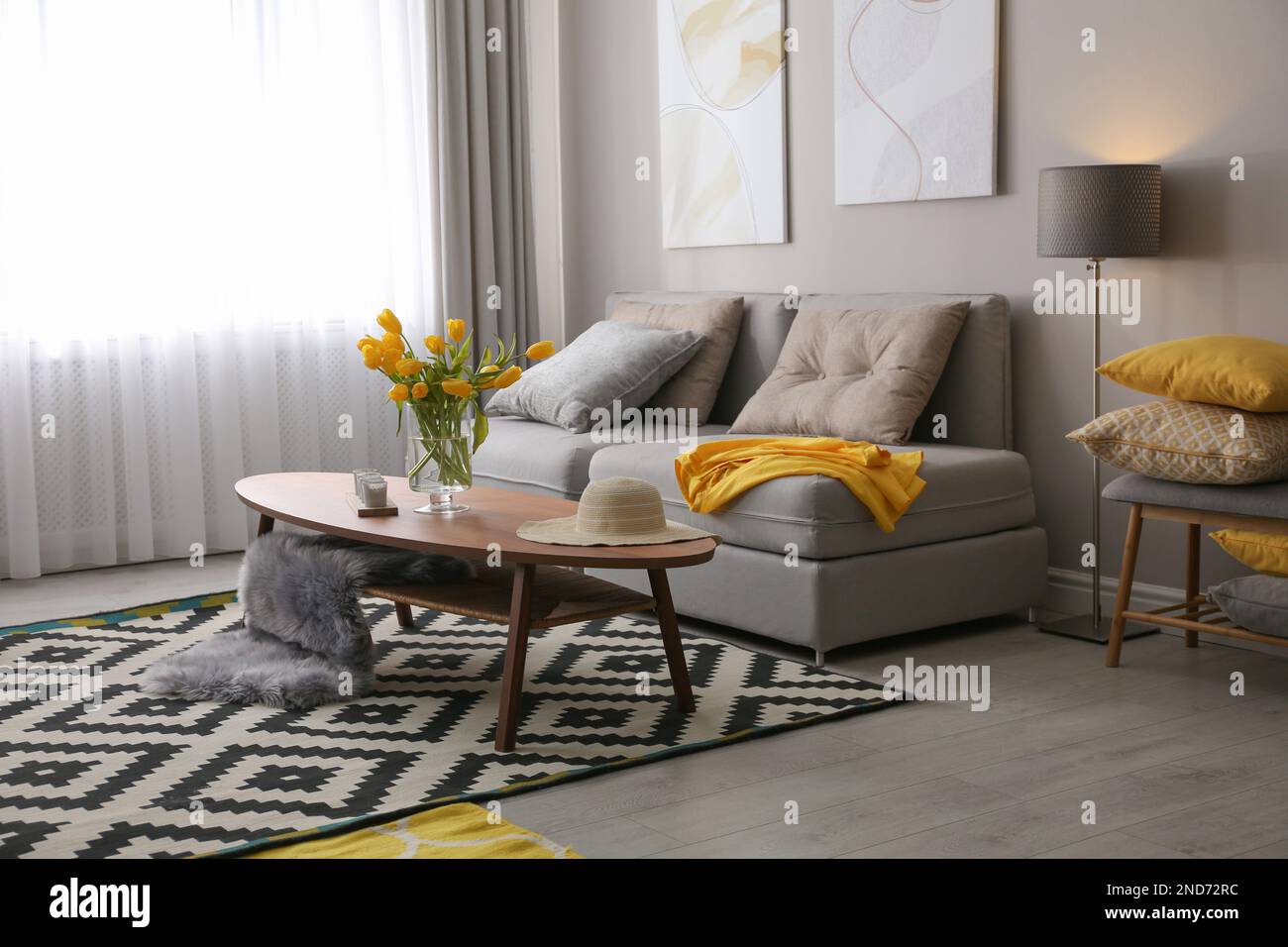 Stylish living room interior with comfortable sofa. Interior design in ...