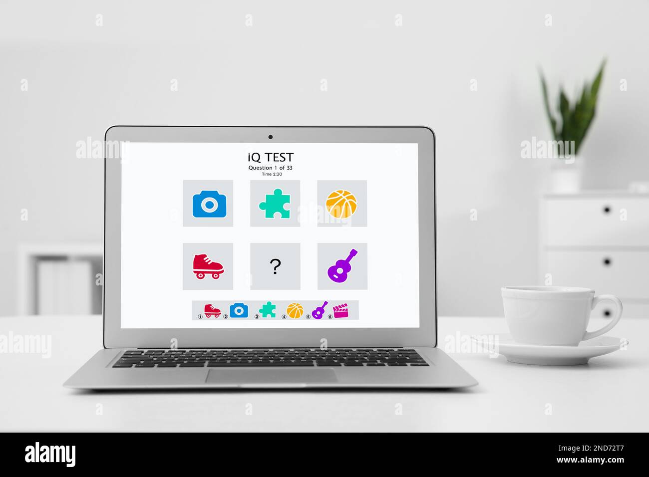 Modern laptop with IQ test on screen in office Stock Photo - Alamy