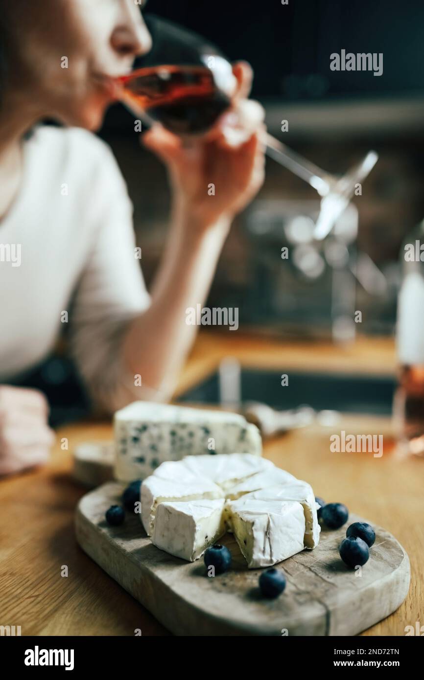 Women drinking a rose wine with french brie cheese Stock Photo - Alamy