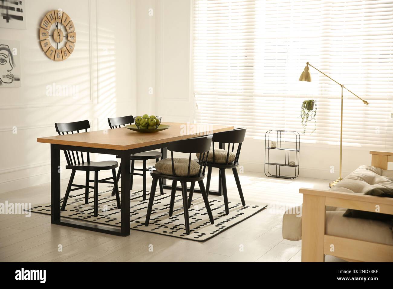 Stylish wooden dining table and chairs in room. Interior design Stock ...
