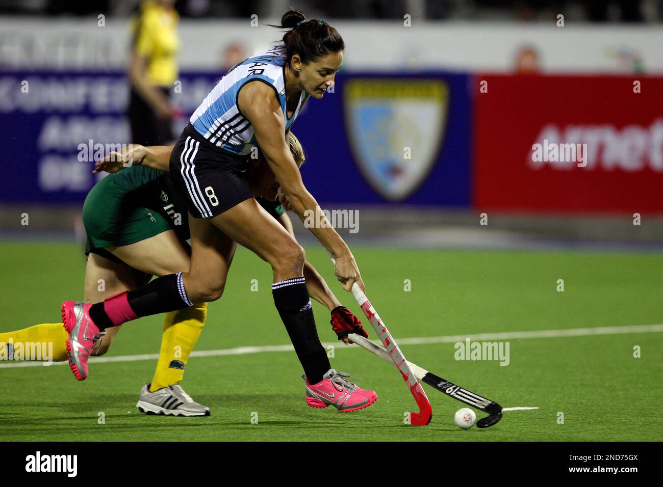 Argentina's Luciana Aymar, front, battles for the ball with South ...