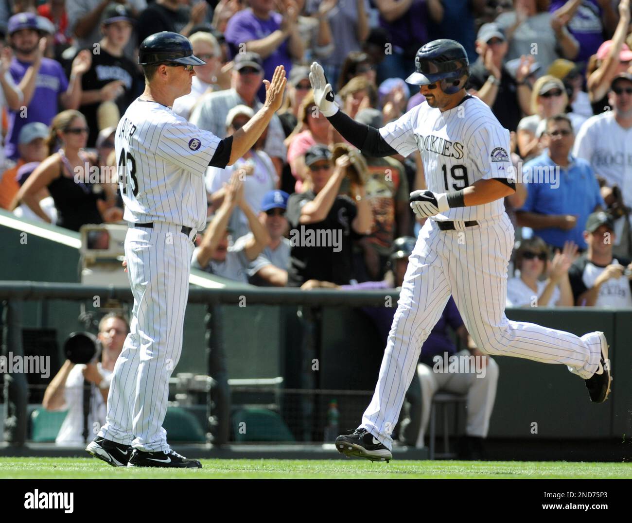 Colorado Rockies' coach, Rich Dauer, left, congratulates Ryan ...