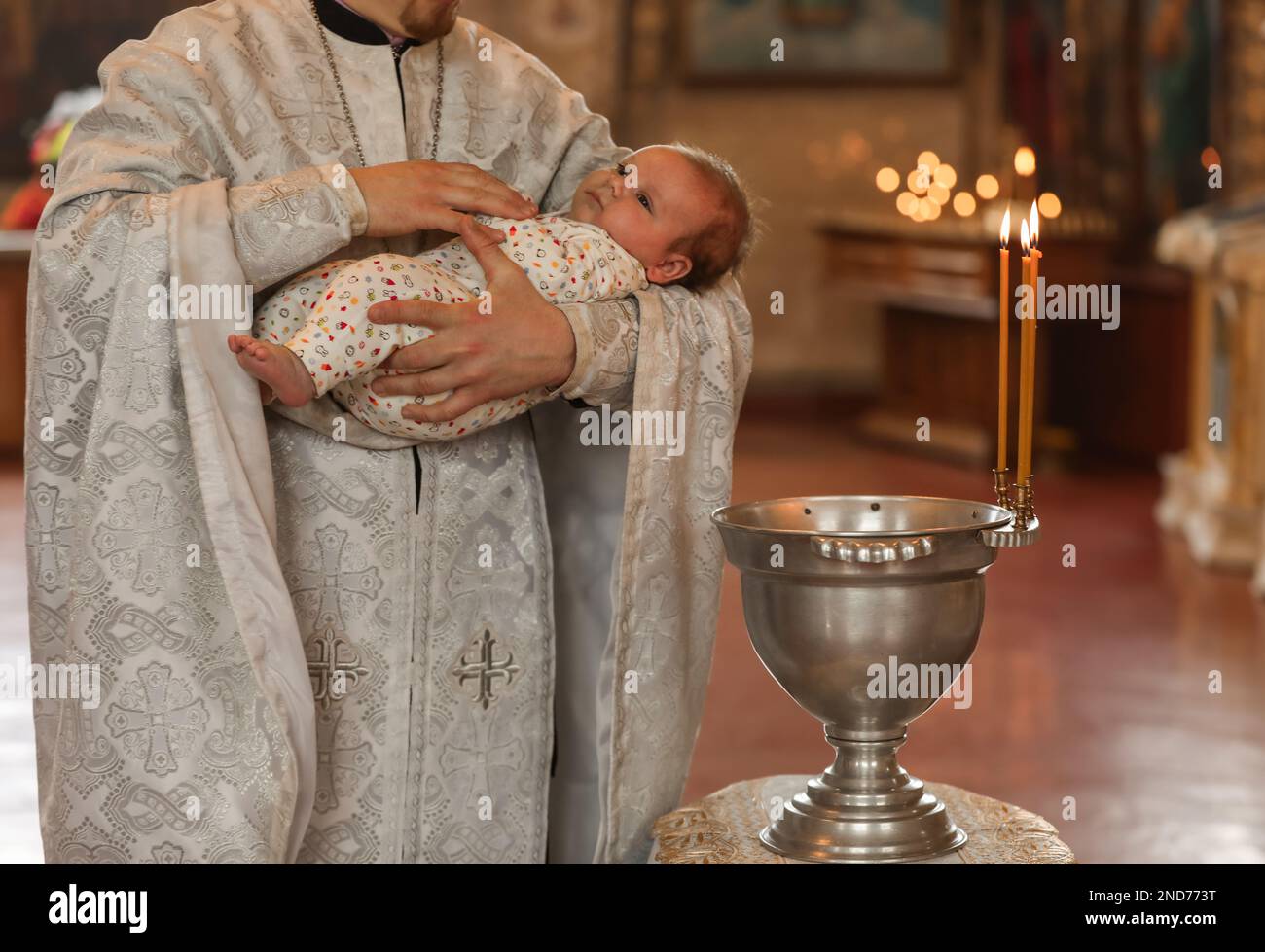 Priest baptizing girl hi-res stock photography and images - Alamy