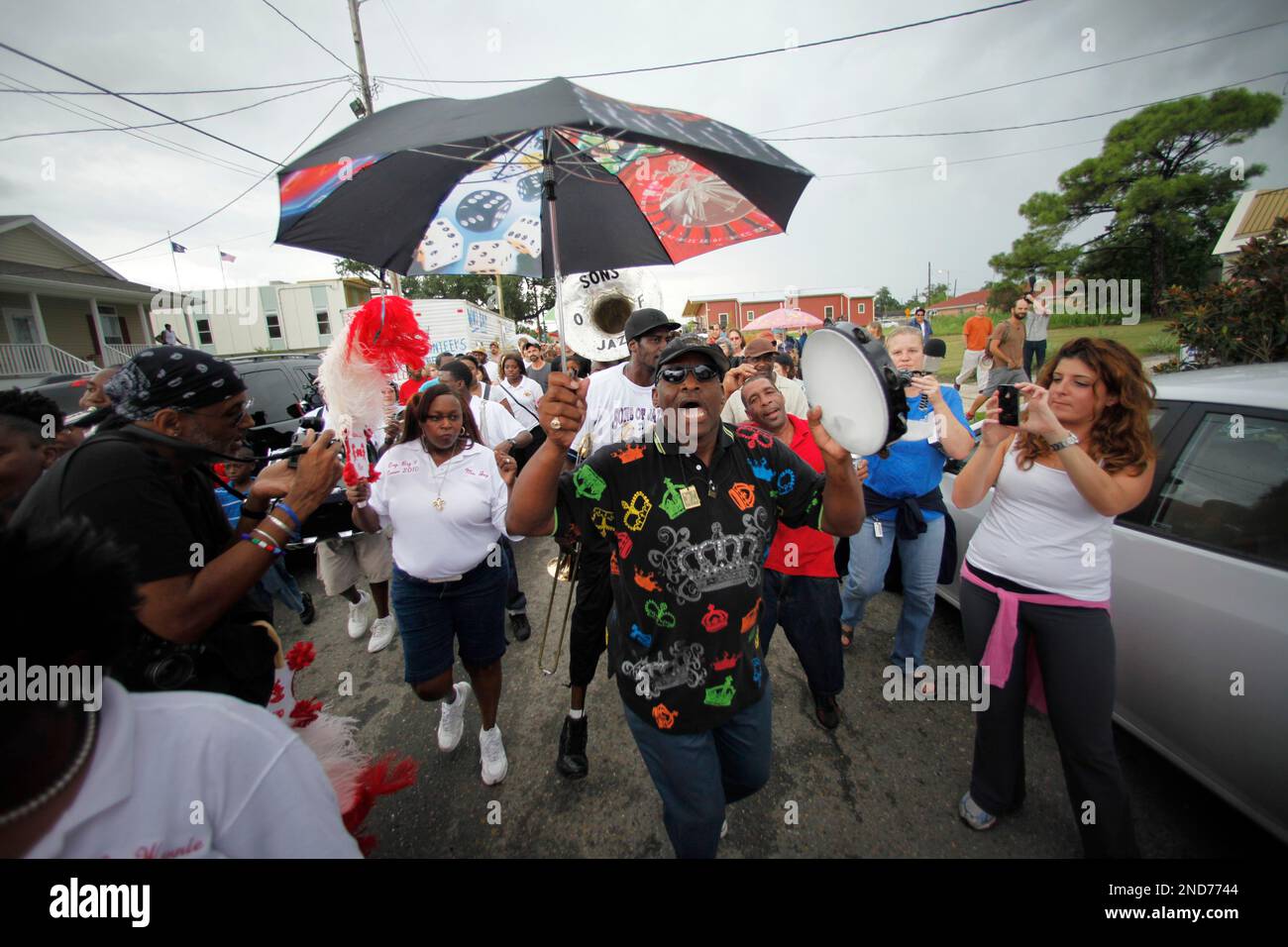 People strut in a second line parade through the Lower Ninth Ward on ...