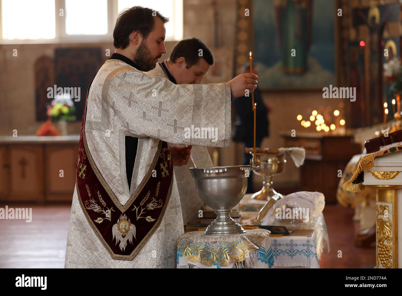 MYKOLAIV, UKRAINE - FEBRUARY 27, 2021: Deacon and priest conducting ...