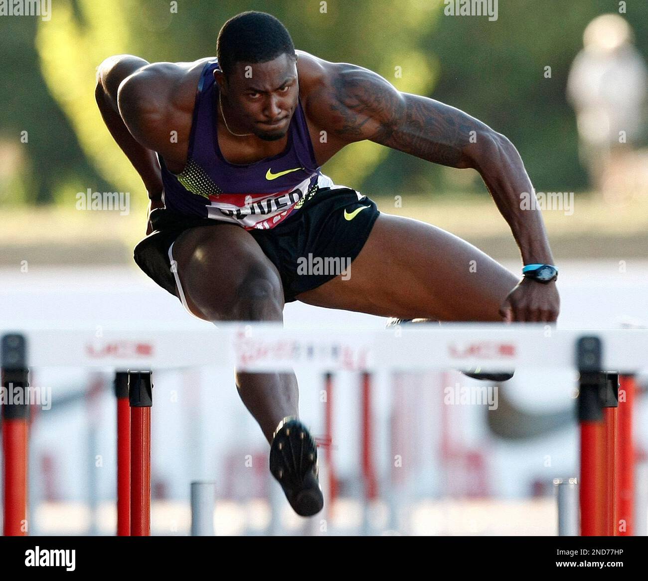 David Oliver of the United States competes on his way to win a Men's ...