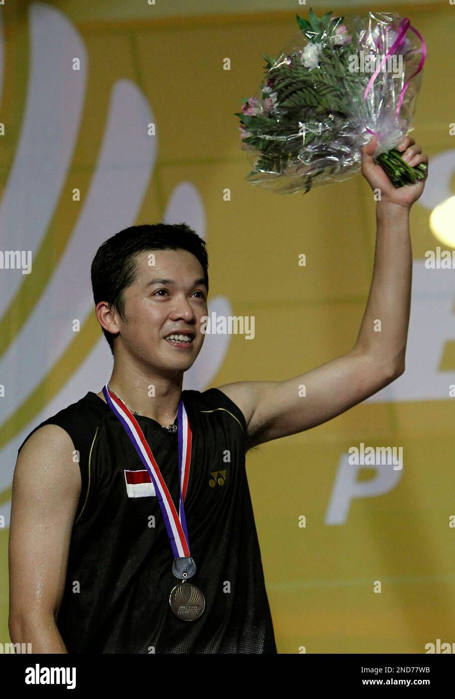 Taufik Hidayat of Indonesia poses on the podium after he finished ...