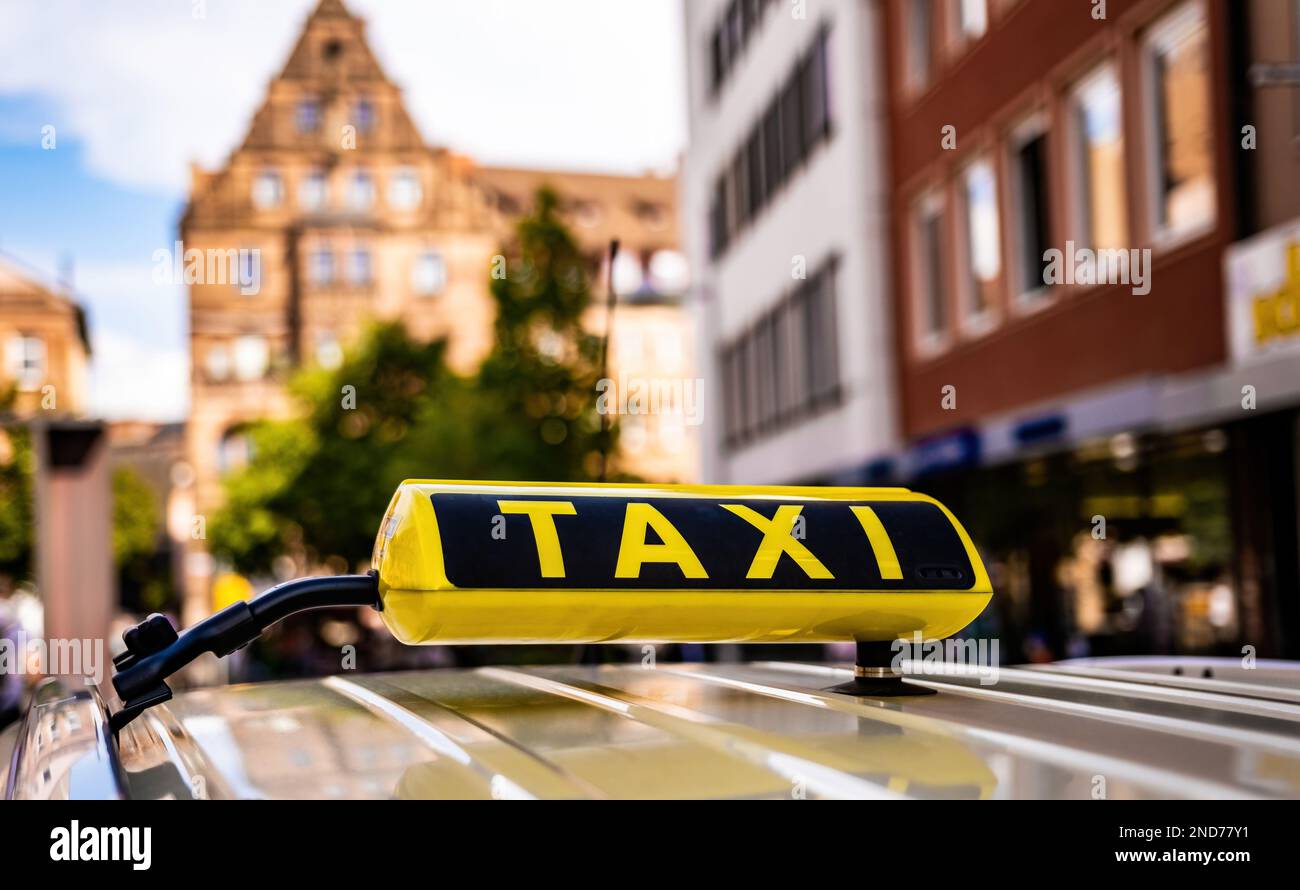 Yellow taxi sign in old historical town Stock Photo - Alamy Yellow taxi sign in old historical town Stock Photo - Alamy