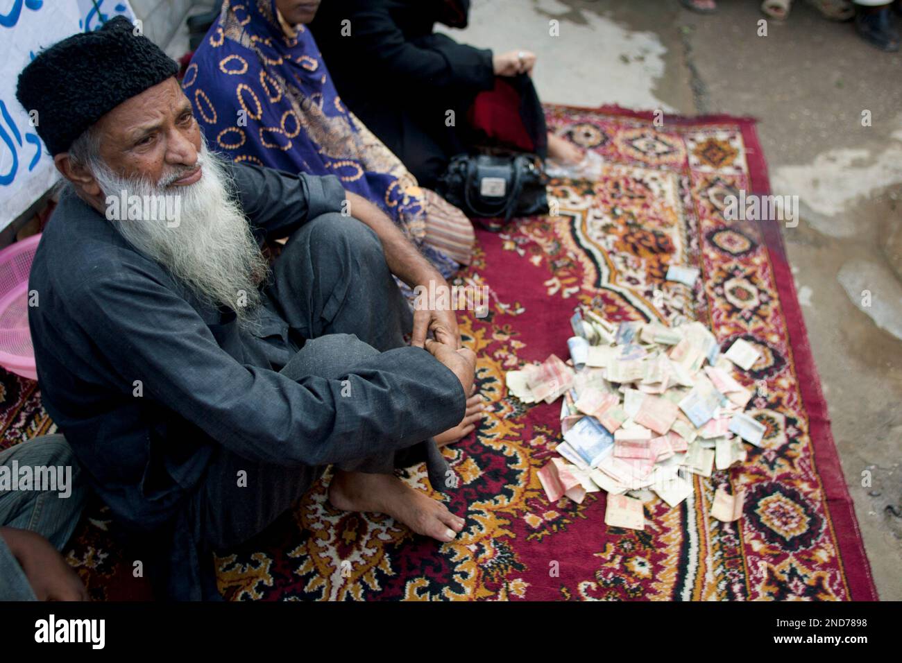 In this photo taken on Aug. 2, 2101 humanitarian leader Abdul Sattar Edhi sits on the side of a ...