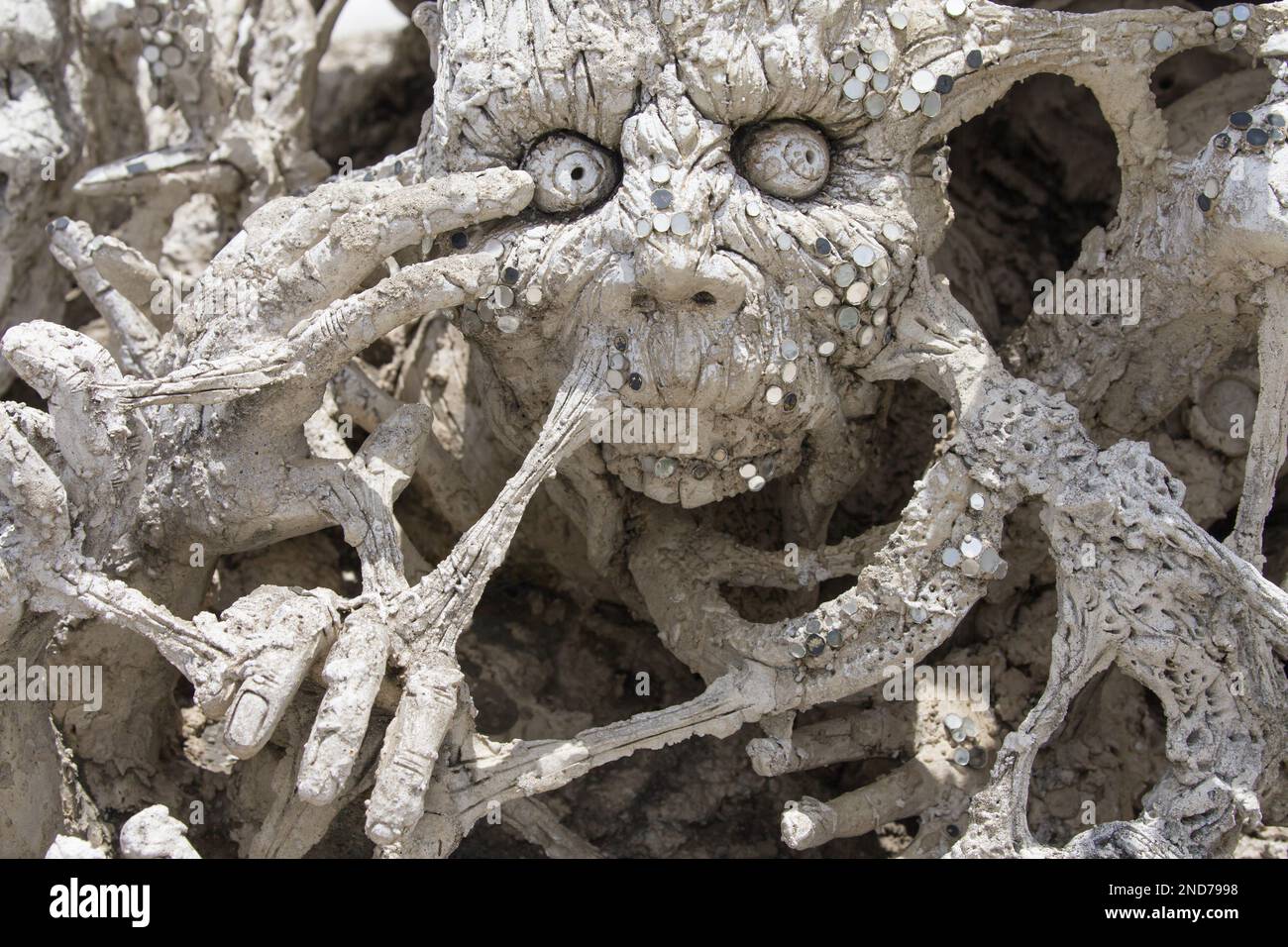 Sculpture of spectral face at Wat Rong Khun, Chiang Rai, Thailand Stock ...