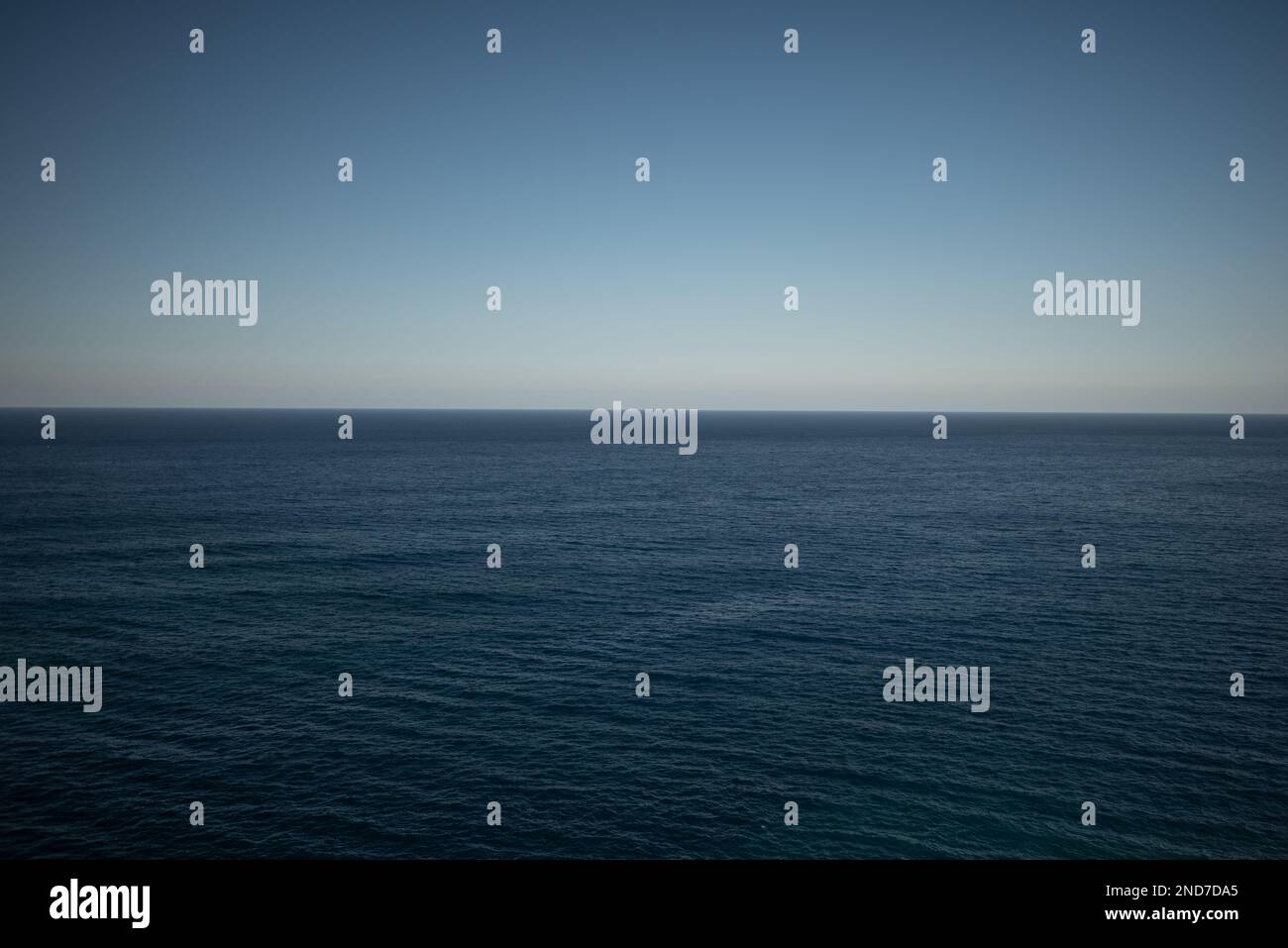 Blue ocean or sea background with blank space. Blue sky above calm ...