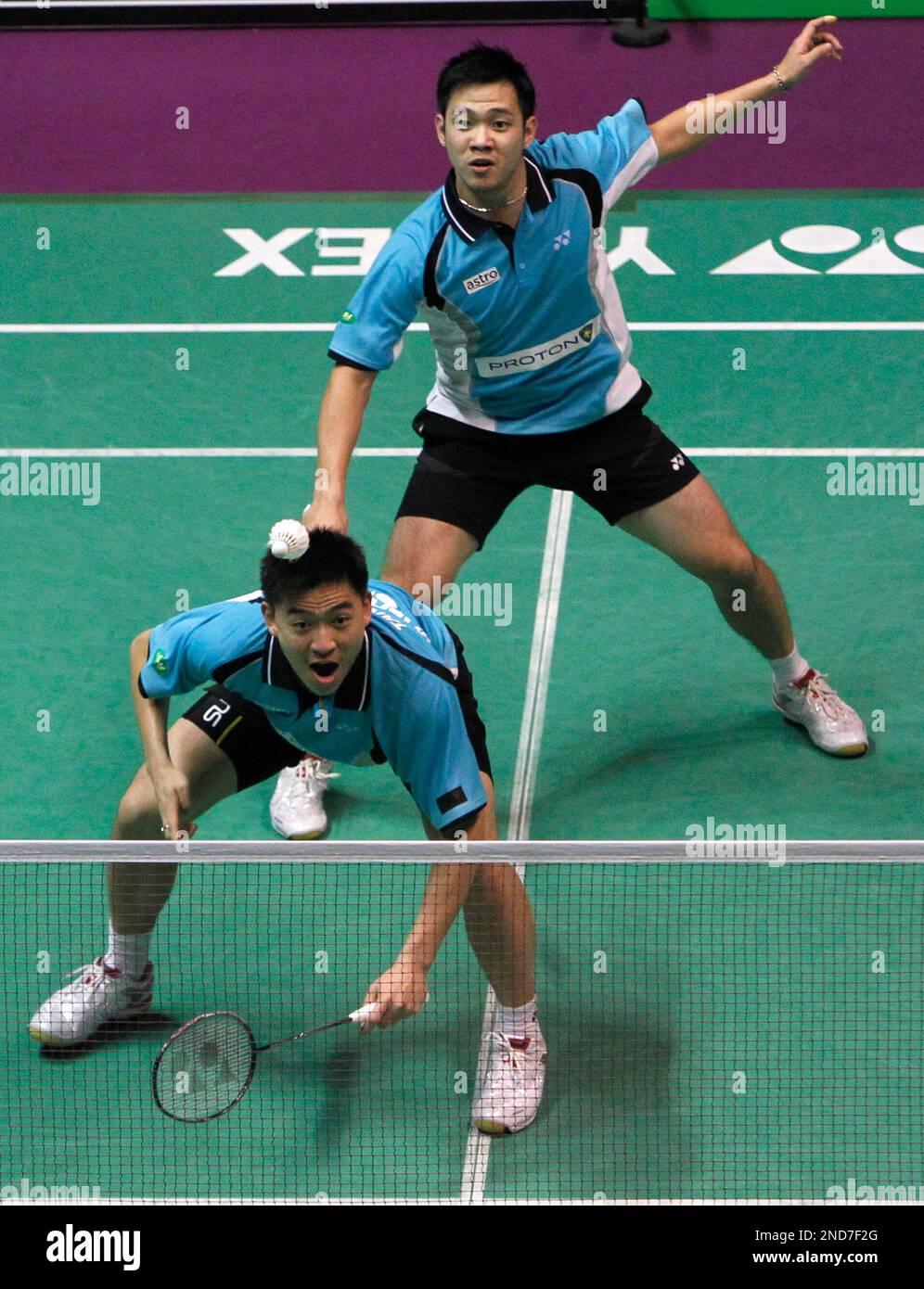 Kien Keat Koo, and Boon Heong Tan, top, of Malaysia return a shot ... Kien Keat Koo, and Boon Heong Tan, top, of Malaysia return a shot ...