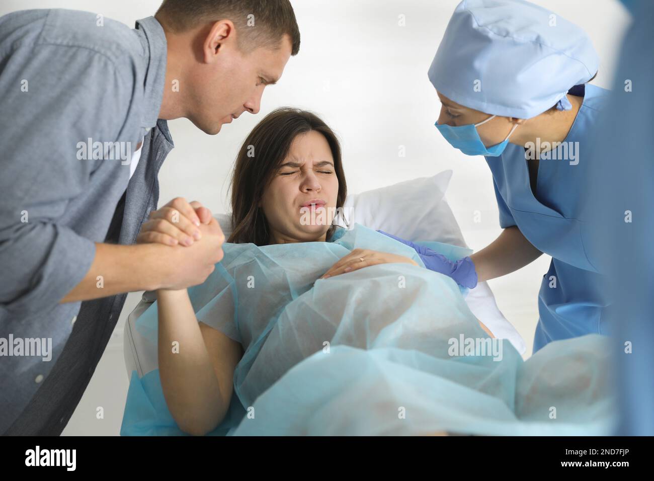 Woman giving child birth in maternity hospital Stock Photo - Alamy