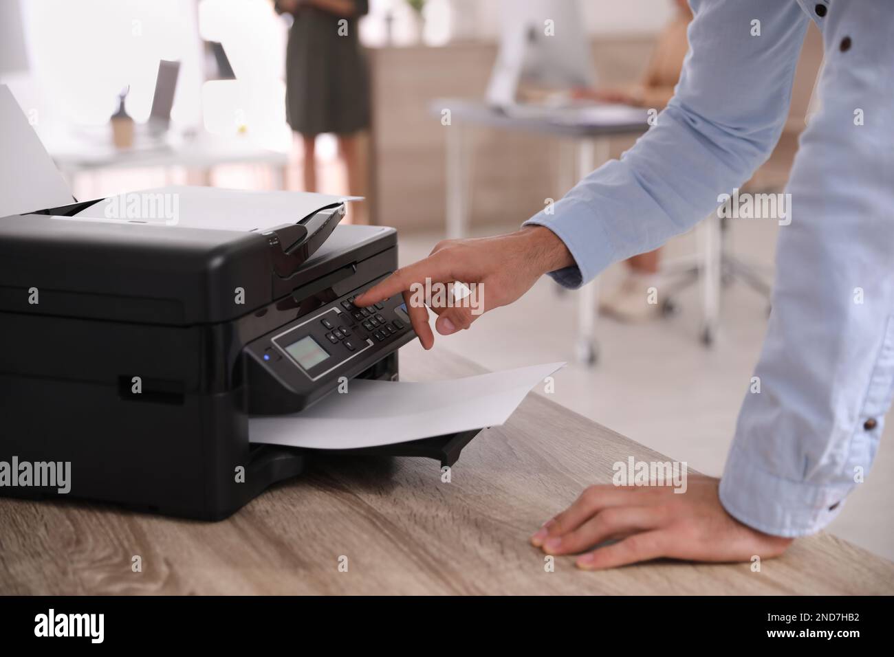 Employee using modern printer in office, closeup Stock Photo - Alamy