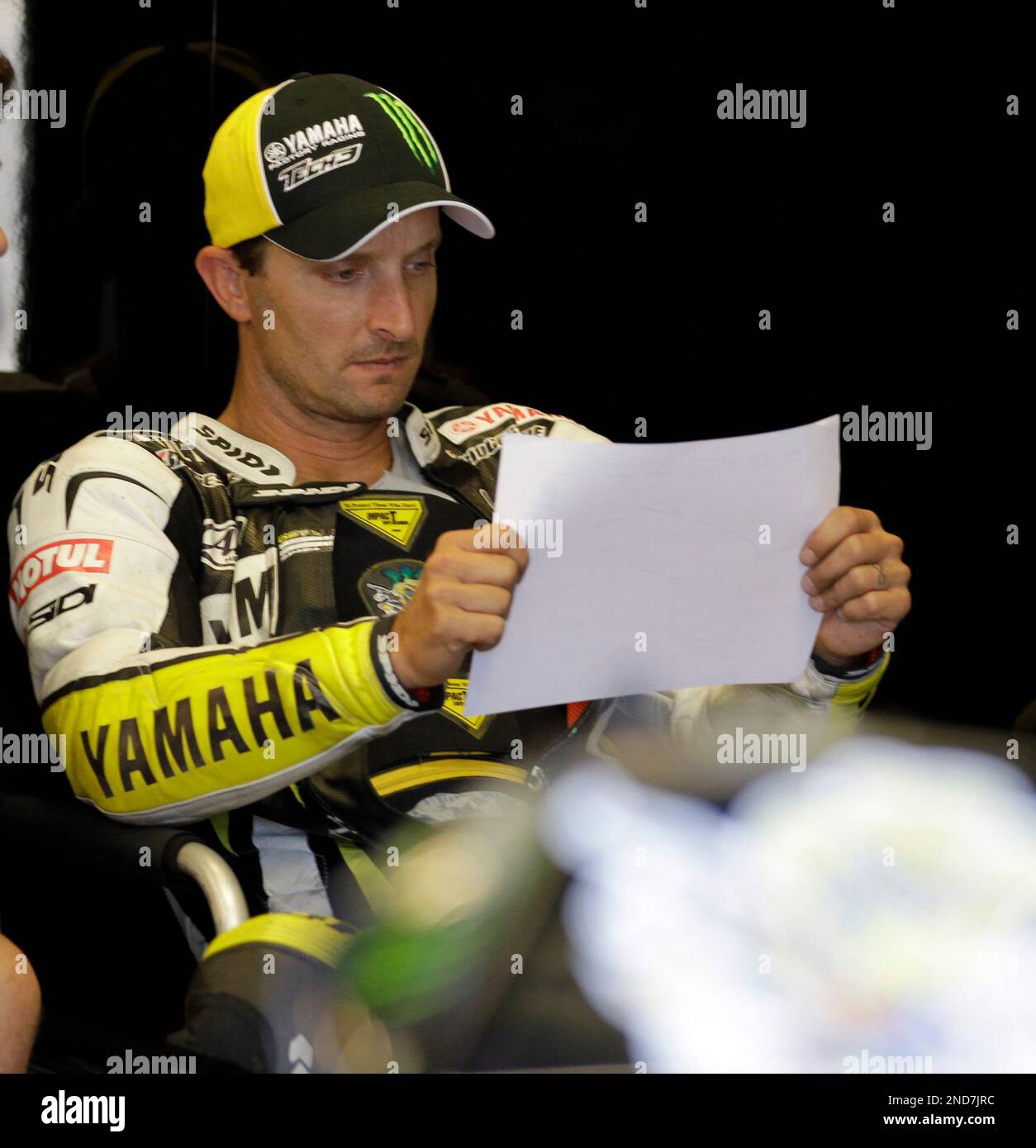 Colin Edwards looks over a map of the course before practice for the ...