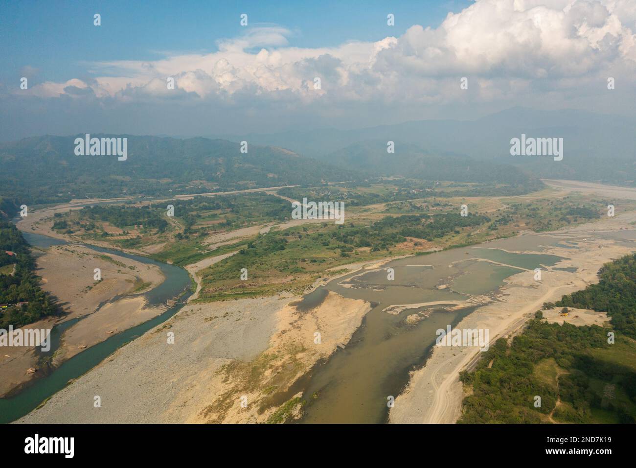 A shallow river in a mountain valley during the dry season. Luzon ...