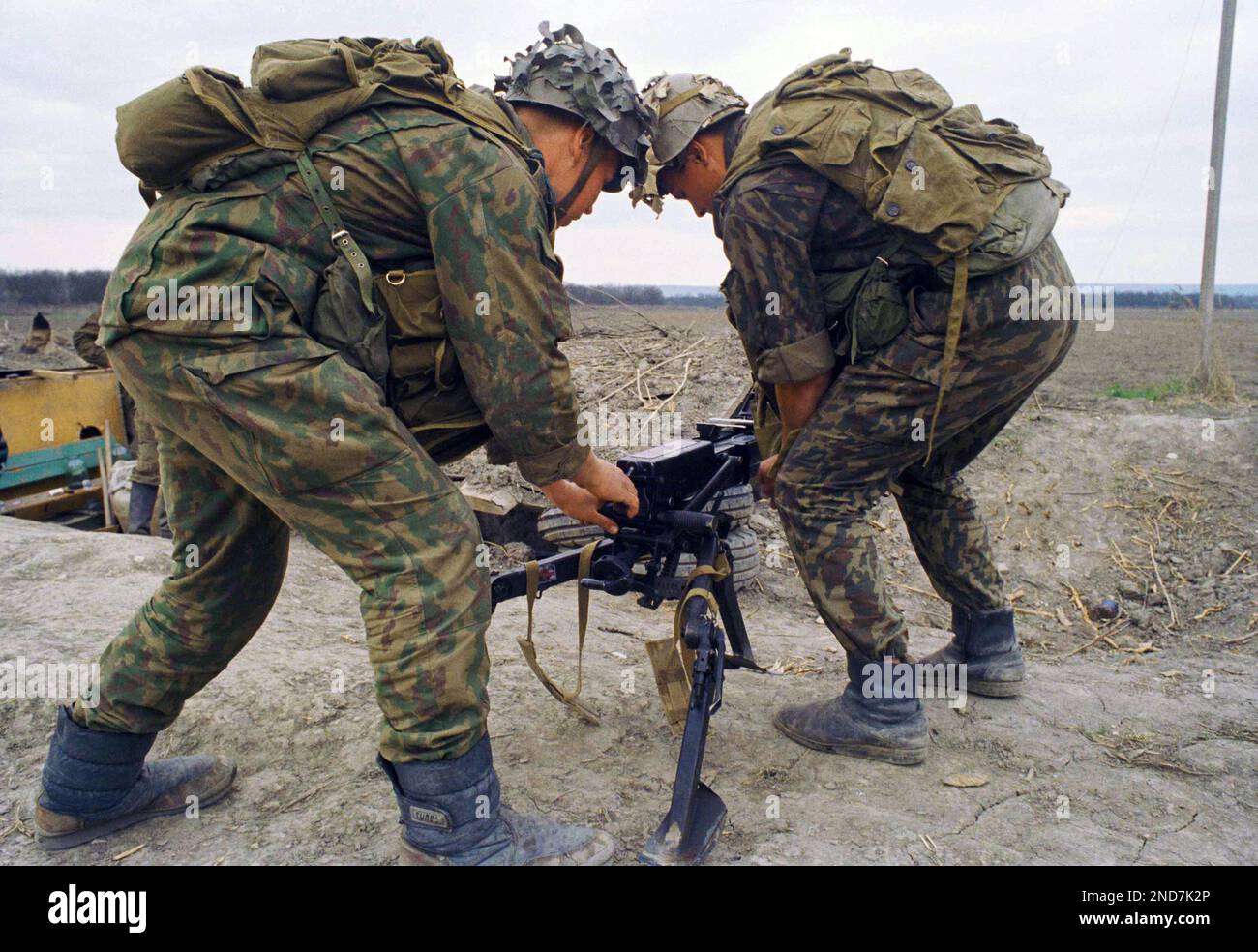 Russian paratroopers assemble a grenade thrower, nicknamed "the devil's ...