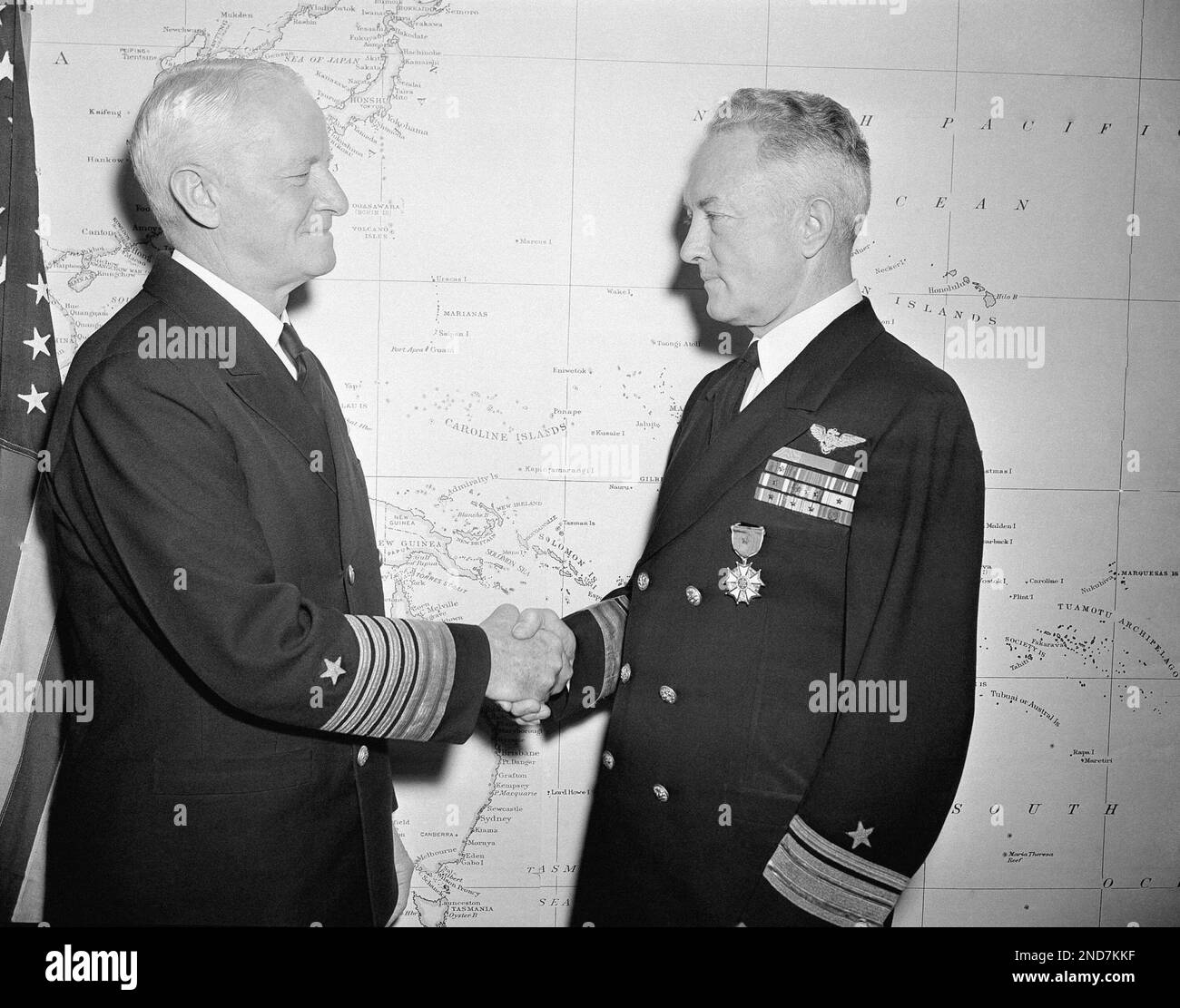 Fleet Admiral Chester W. Nimitz, left, congratulates Rear Admiral ...