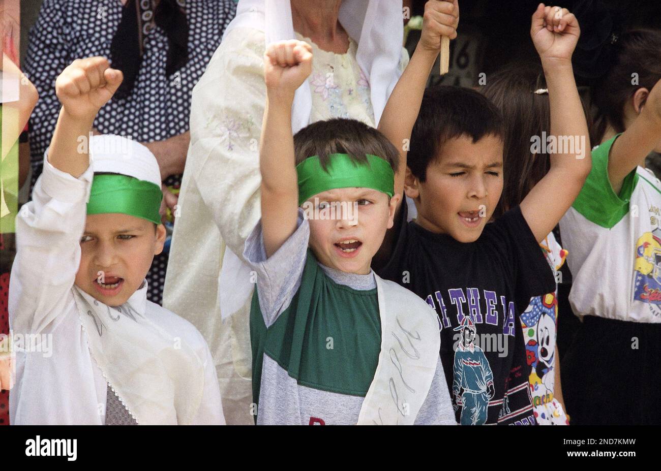 Unidentified Chechen boys, wearing green headbands symbolic of Chechen ...