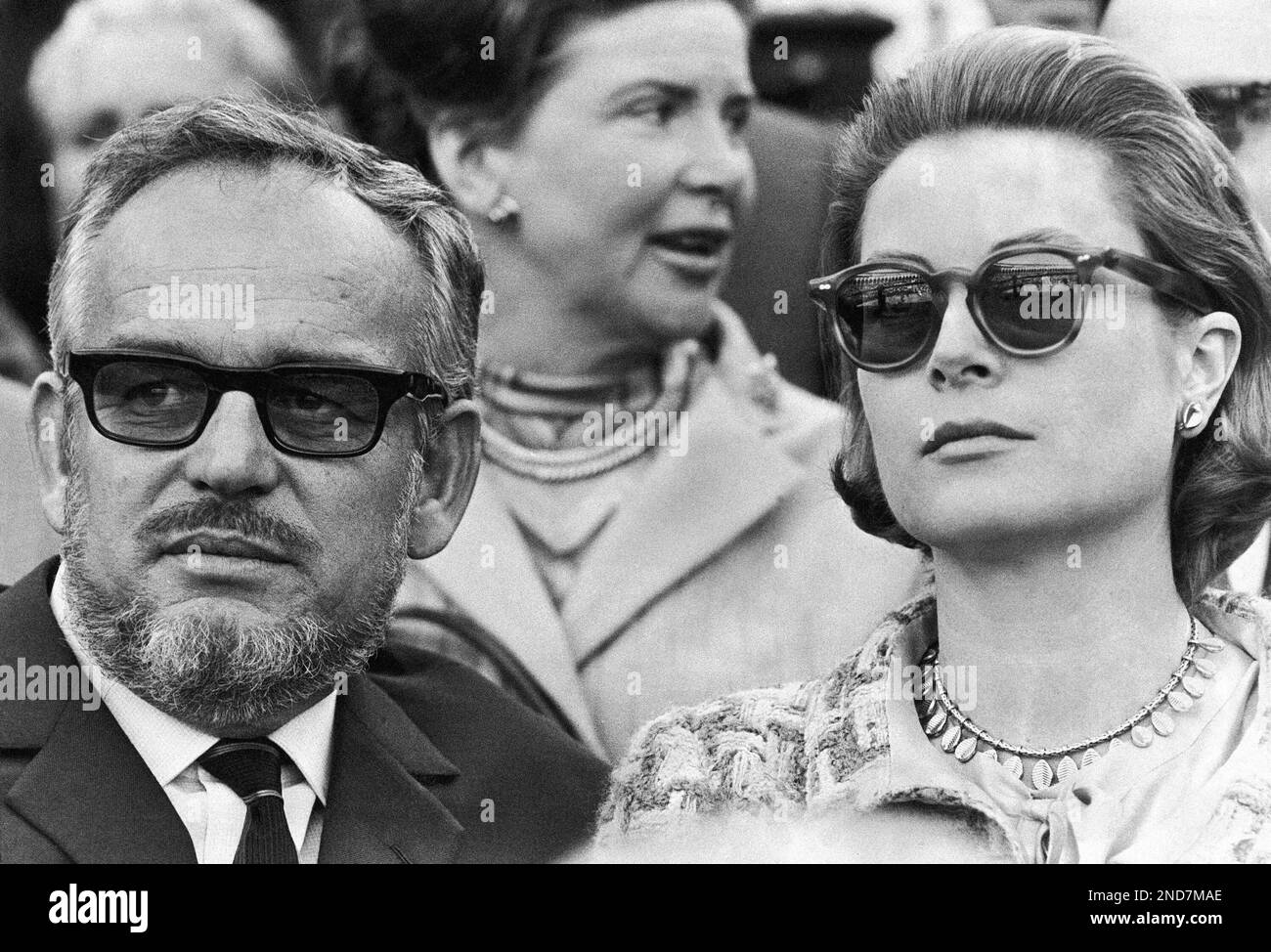 Princess Grace’s sunglasses reflect the bullfight scene as she and her ...