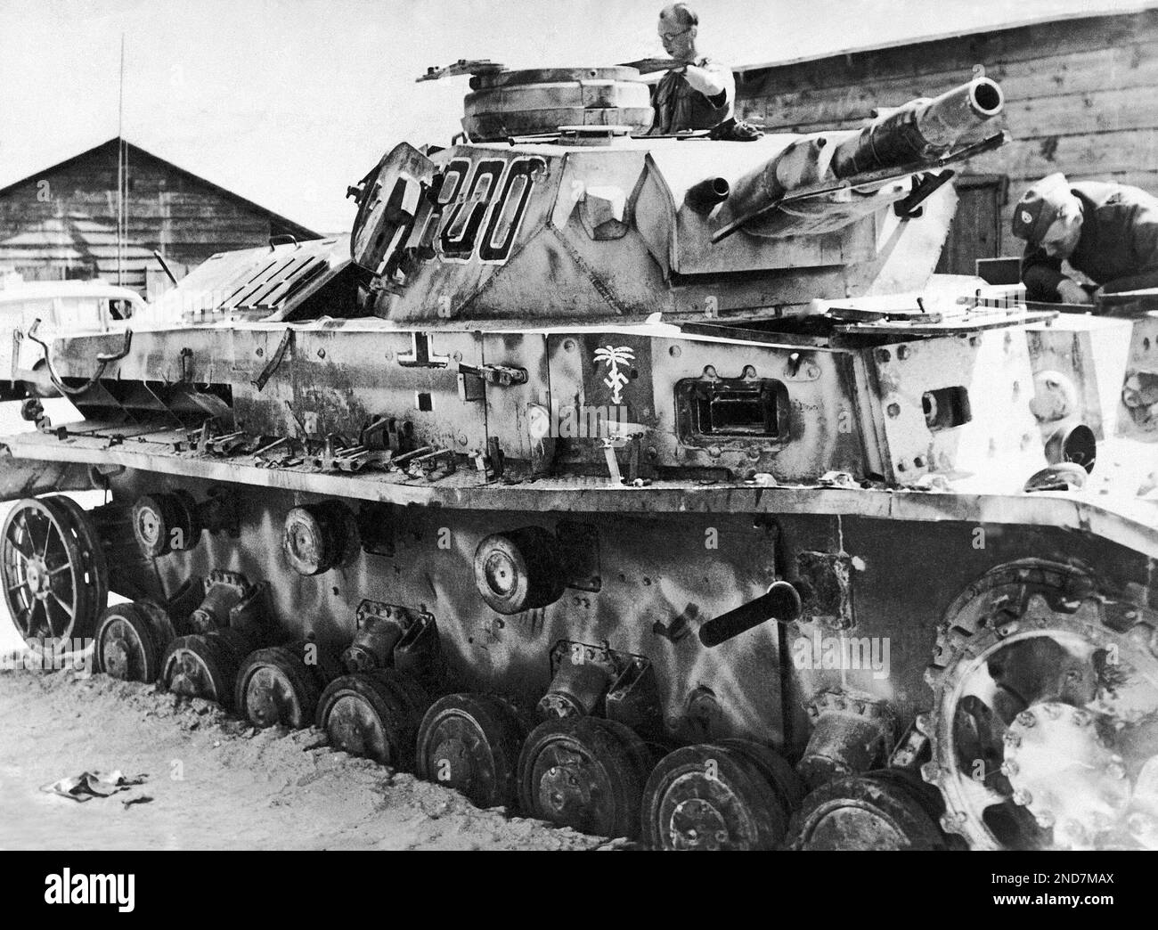 Enemy tanks, captured in the desert, are examined, revealing the ...