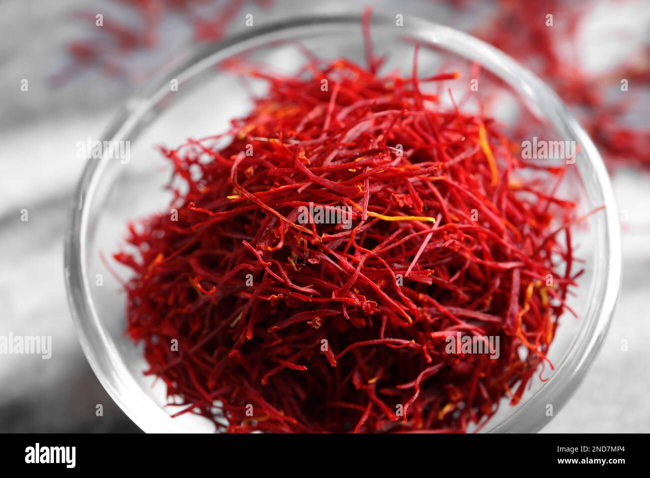 Dried saffron in glass bowl, closeup view Stock Photo - Alamy