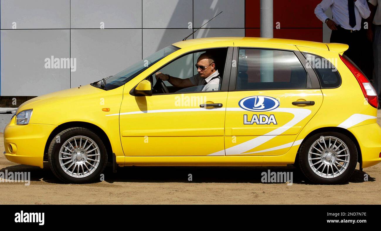 Russian Prime Minister Vladimir Putin is seen in a Russian-made Lada ...