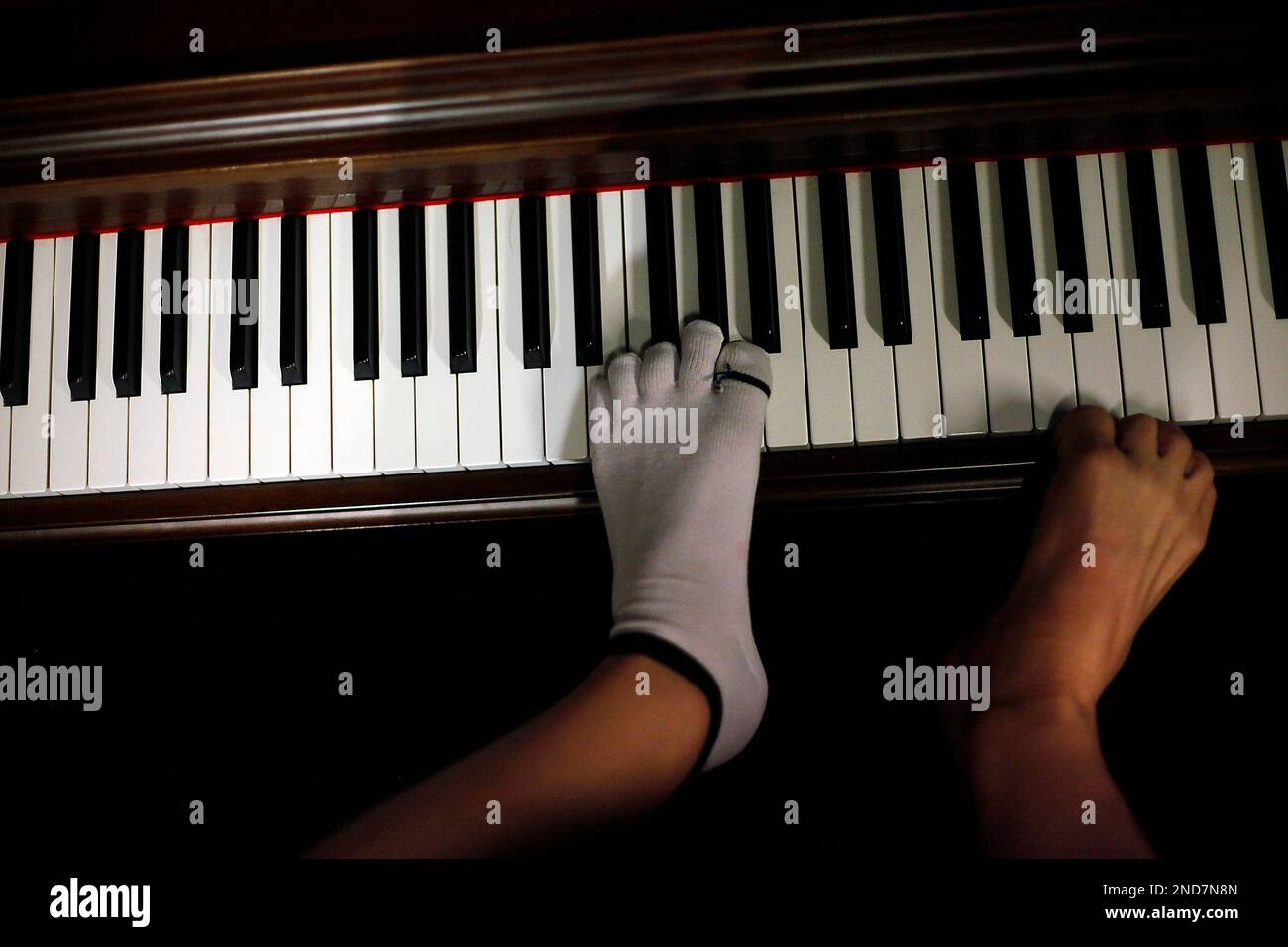 In this Aug. 26, 2010 photo, pianist Liu Wei plays the piano with his ...