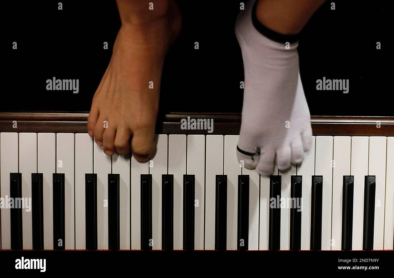 In this Aug. 26, 2010 photo, pianist Liu Wei plays the piano with his ...