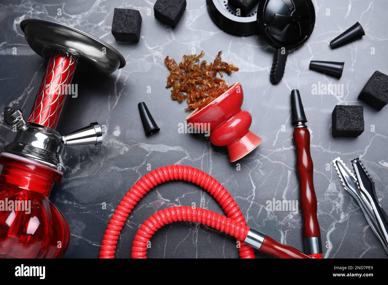 Flat lay composition with parts of hookah on black marble table Stock ...