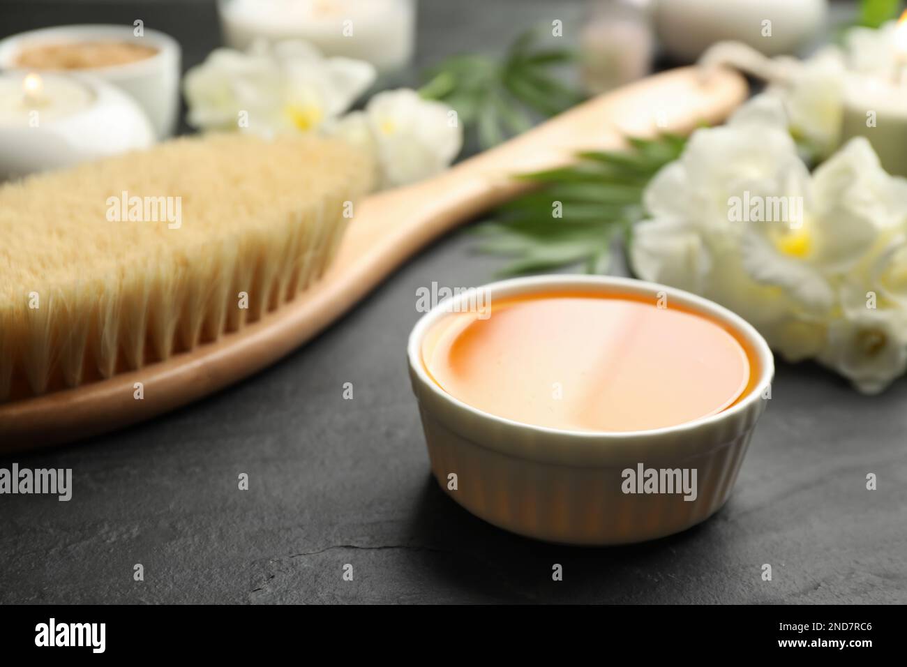 Cosmetic product for spa body wraps on black background Stock Photo - Alamy