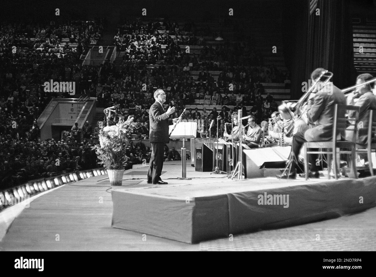 Benny Goodman conducts his band on stage in the Moscow sports palace ...
