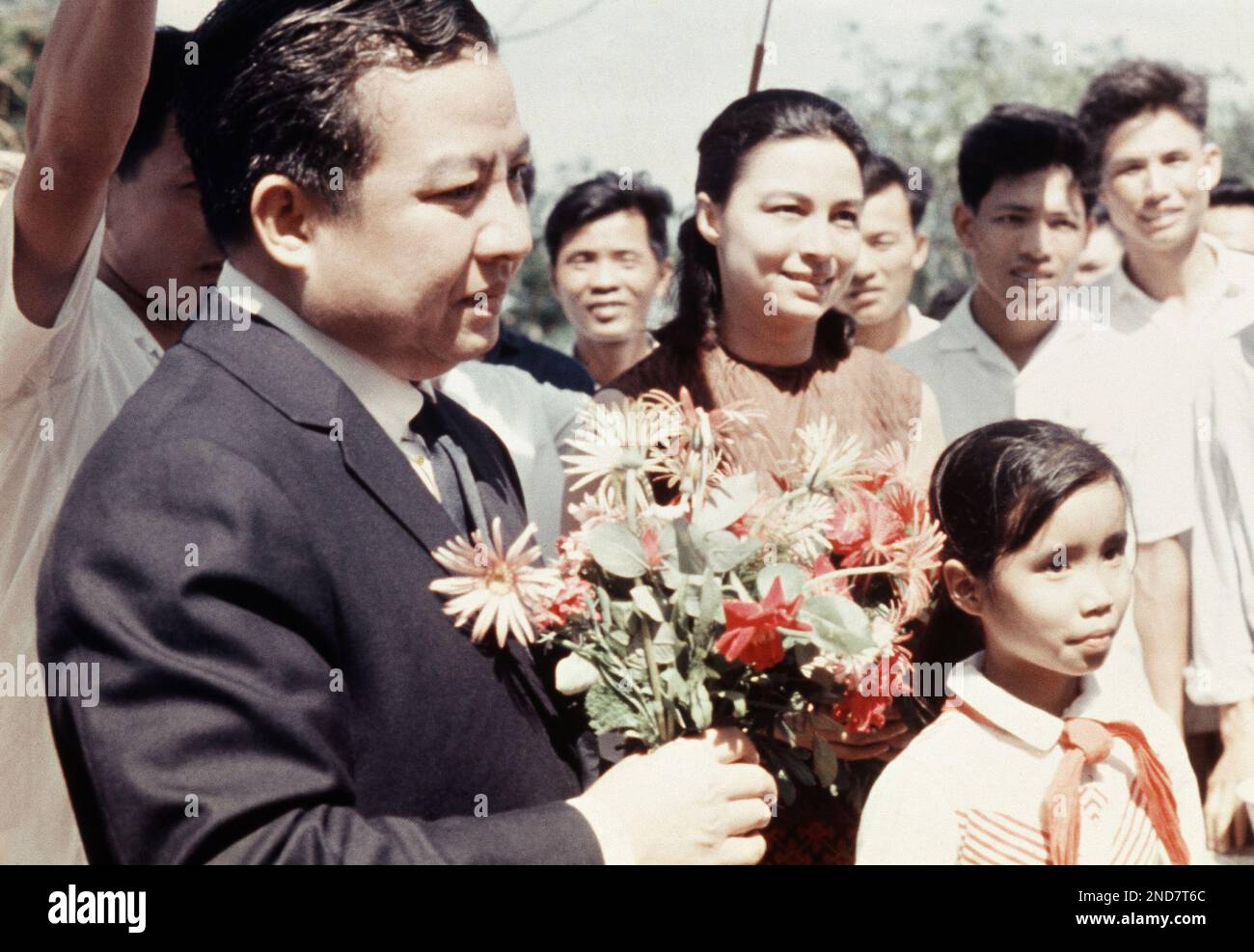 Cambodian Prince Norodom Sihanouk holds flowers at the opening of a ...