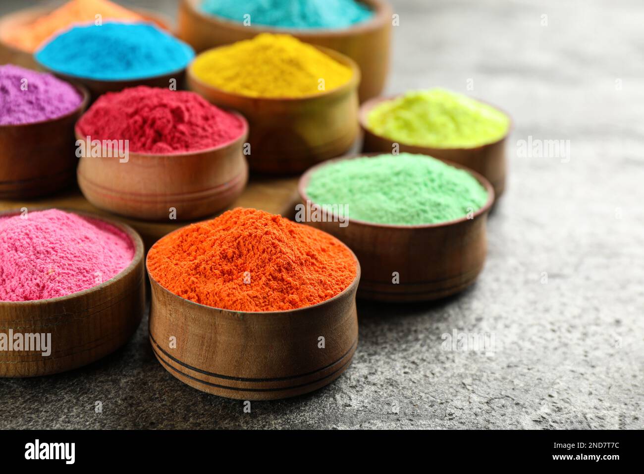 Colorful powder dyes on grey background, closeup. Holi festival Stock ...