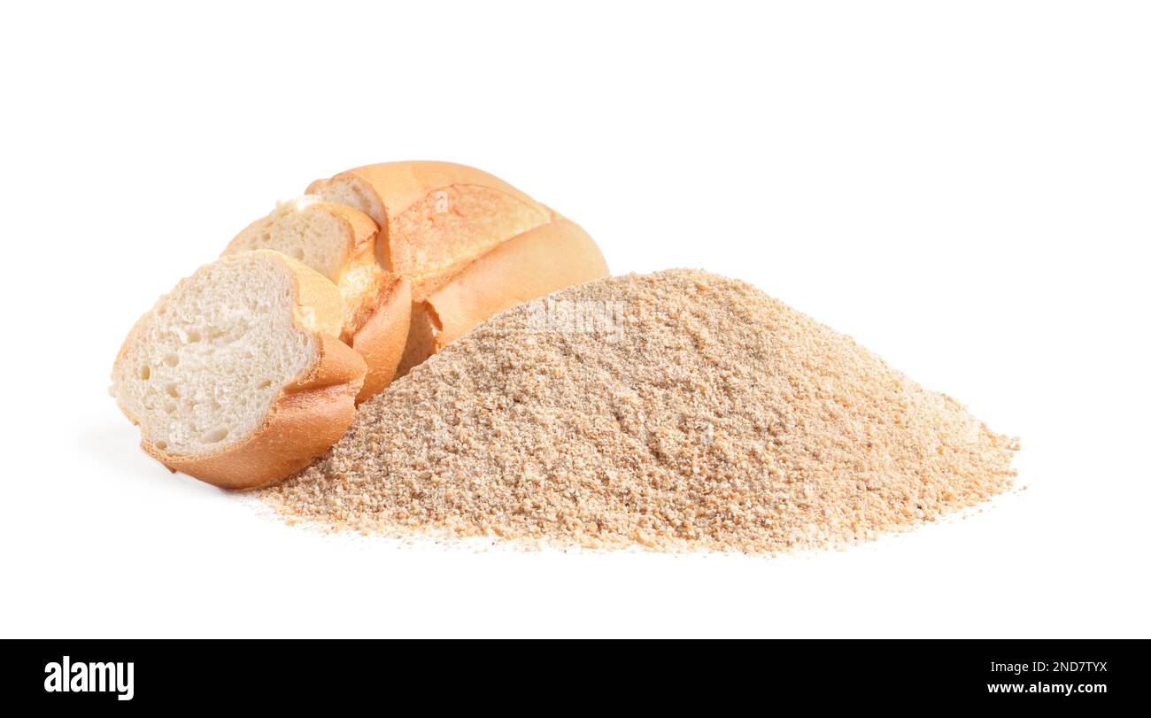 Pile of fresh bread crumbs and sliced loaf on white background Stock ...