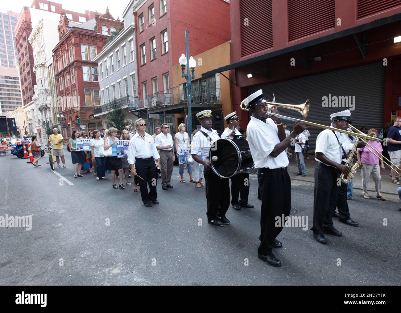 A brass band plays as singer Charmaine Neville, actress Shauna Rappold ...