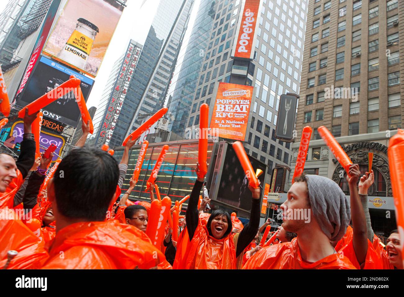 A sea of orange celebrates the announcement that Popeyes Louisiana ...