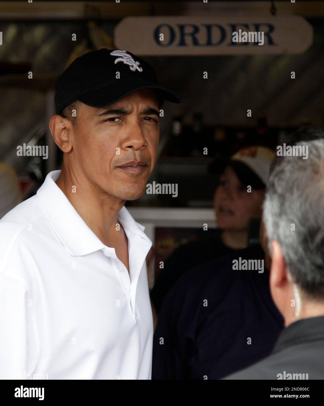 President Barack Obama stands outside Nancy's Restaurant in Oak Bluffs ...