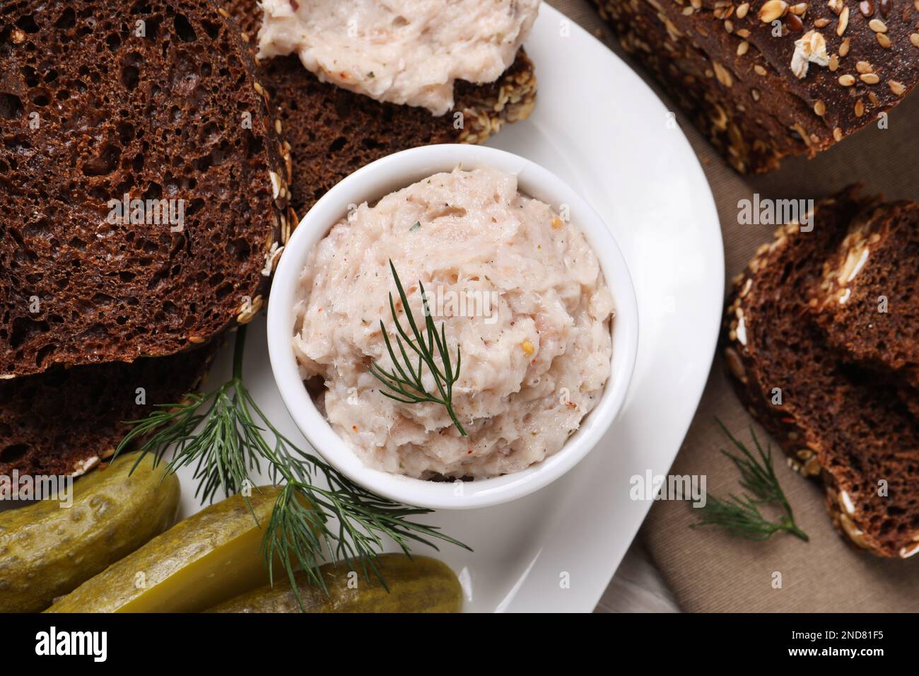 Delicious lard spread, bread and pickles on table, flat lay Stock Photo ...