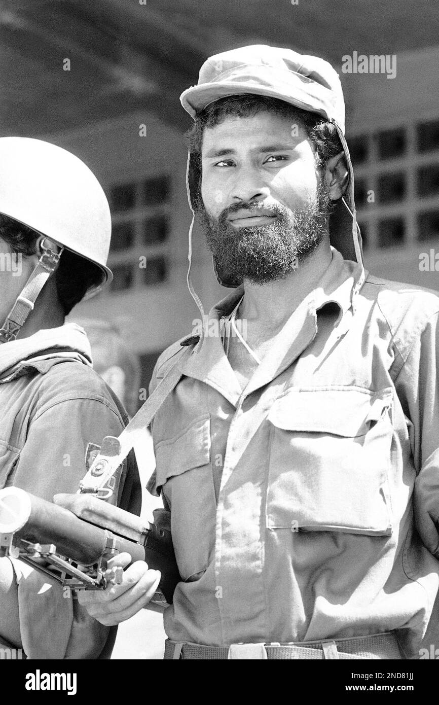 Cambodian soldiers with a Chinese made machine-gun under his arm, wears ...