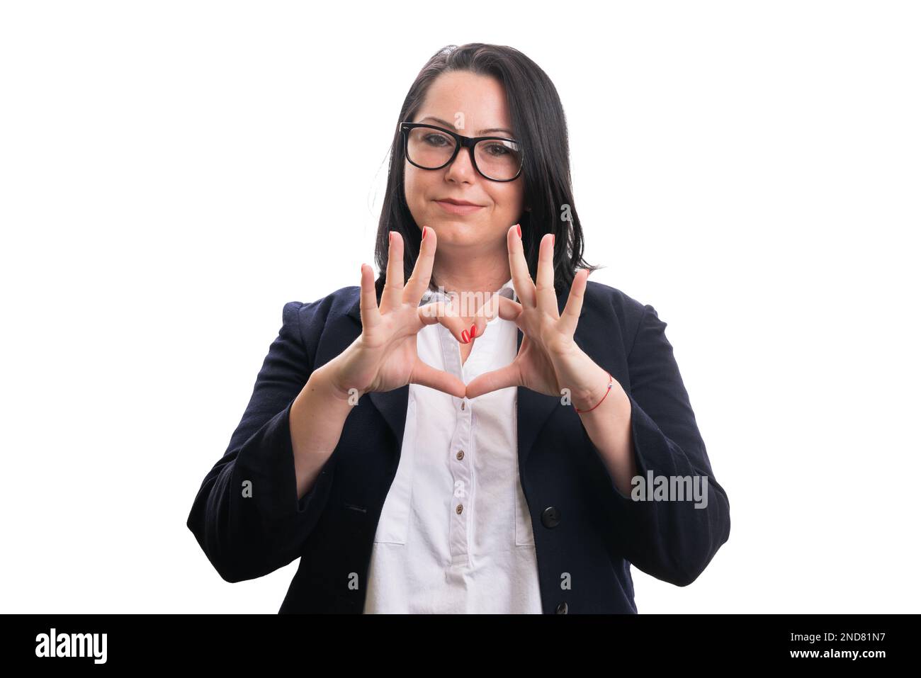 Happy female entrepreneur smiling showing love heart gesture using ...