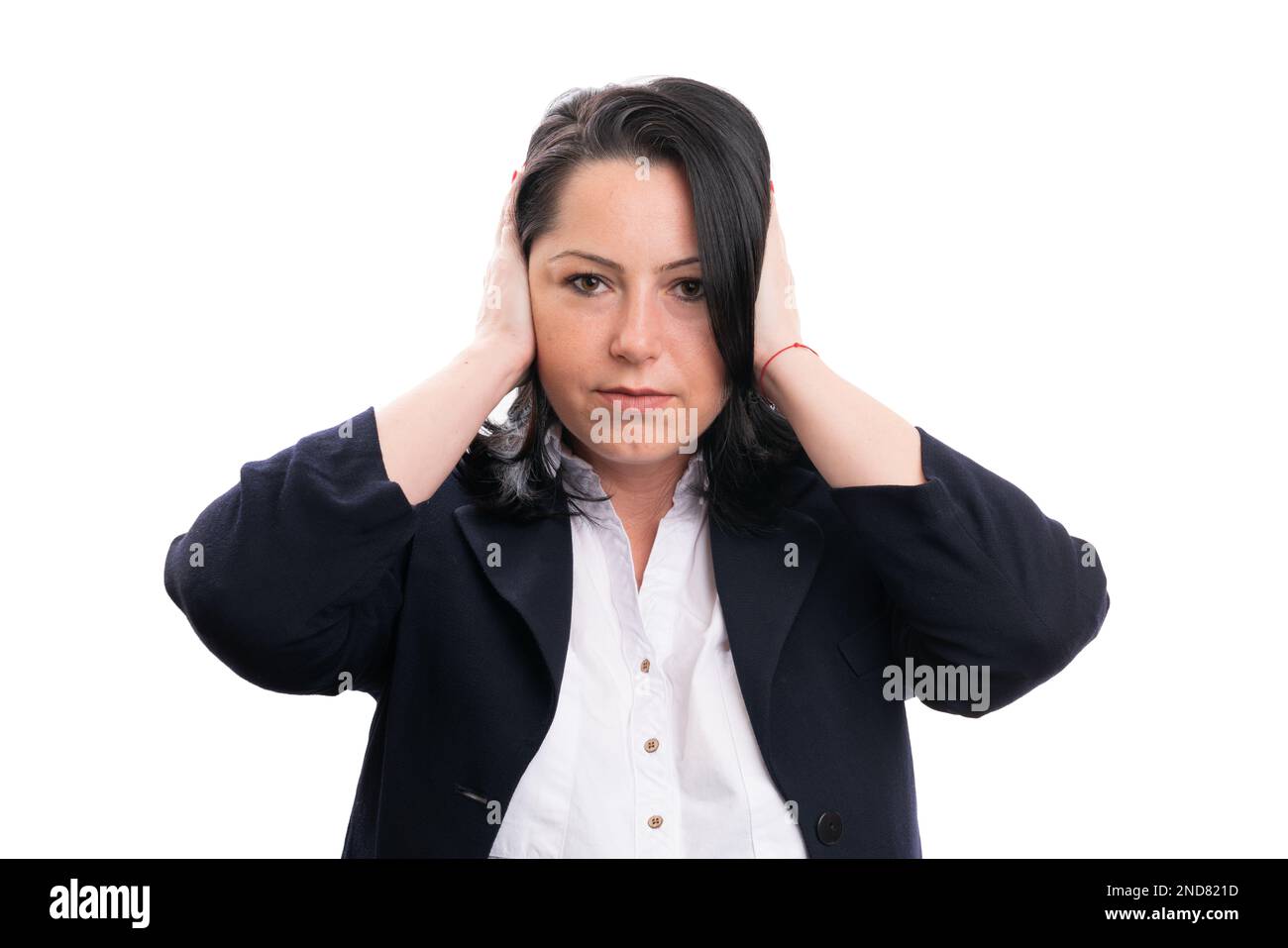 Serious adult businesswoman wearing office suit covering ears using ...