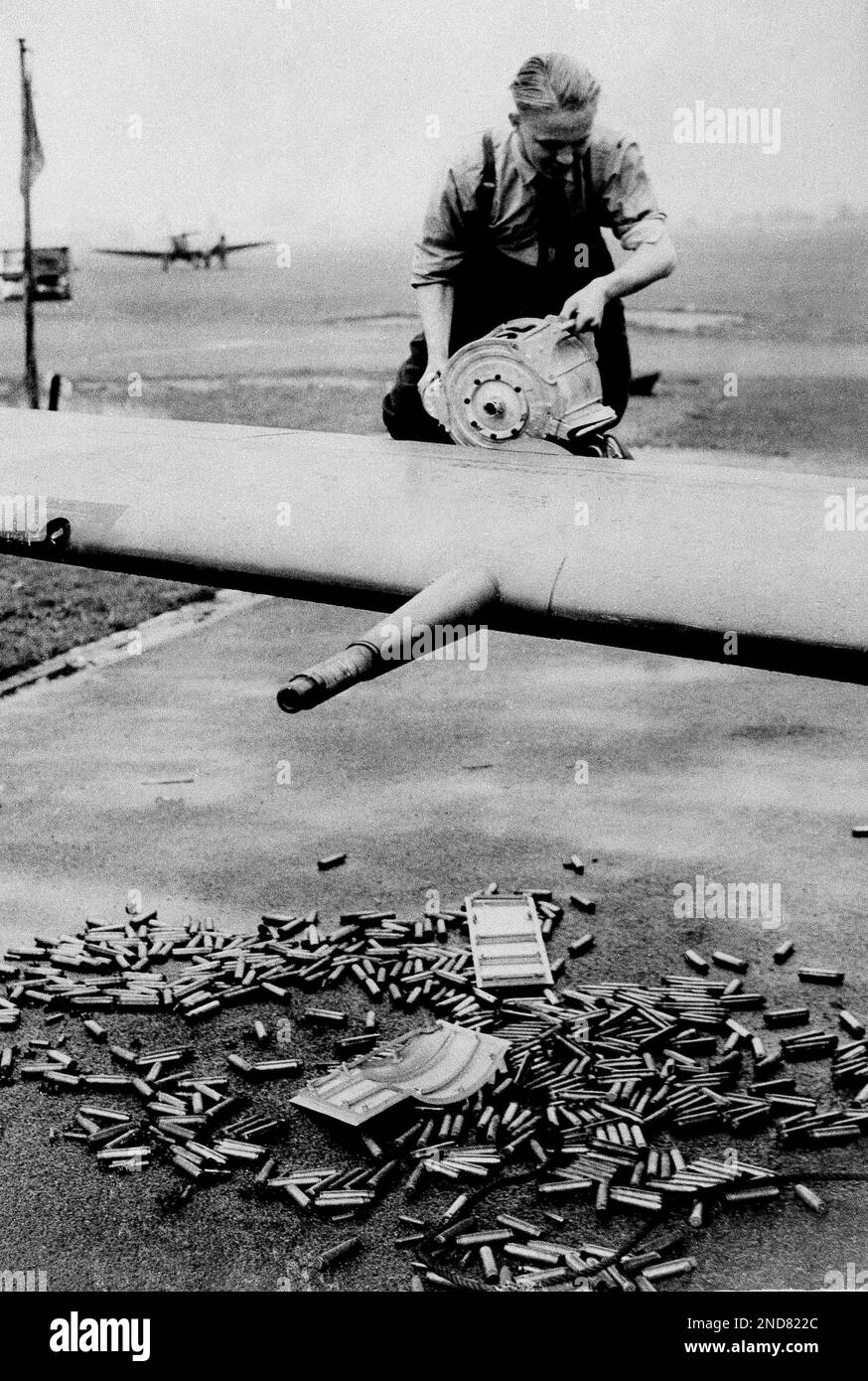 A ground crew member of the Royal Air Force replaces the magazine of a ...