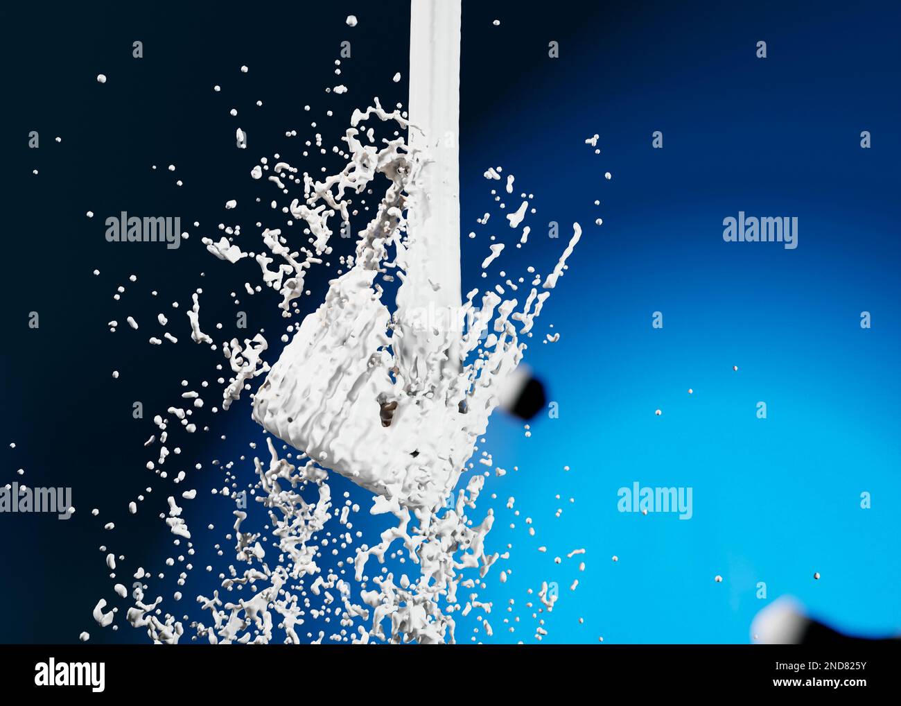 A white liquid stream falling into a puddle of water in the middle of a ...