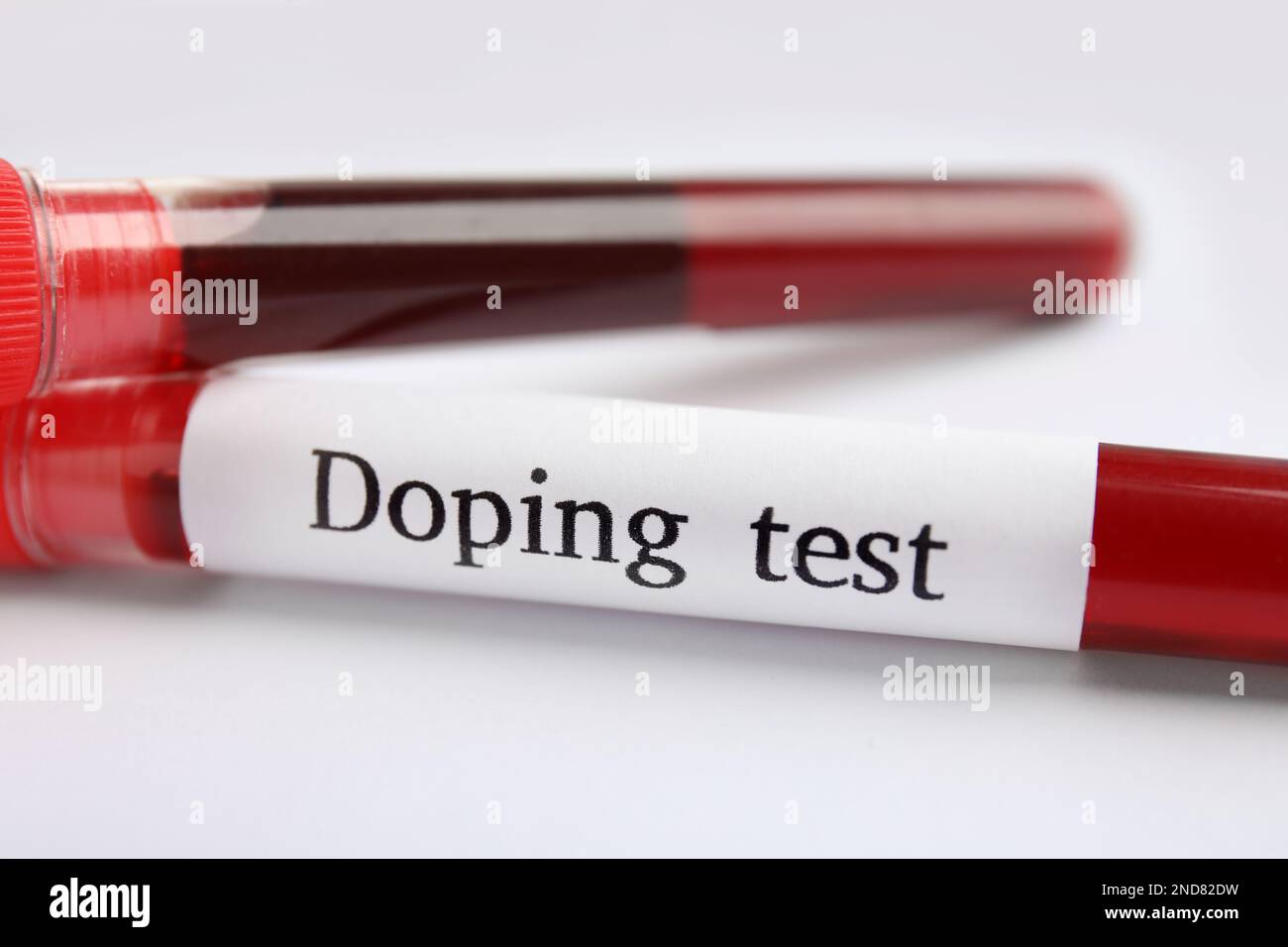 Test tubes with blood samples on white table, closeup. Doping control ...