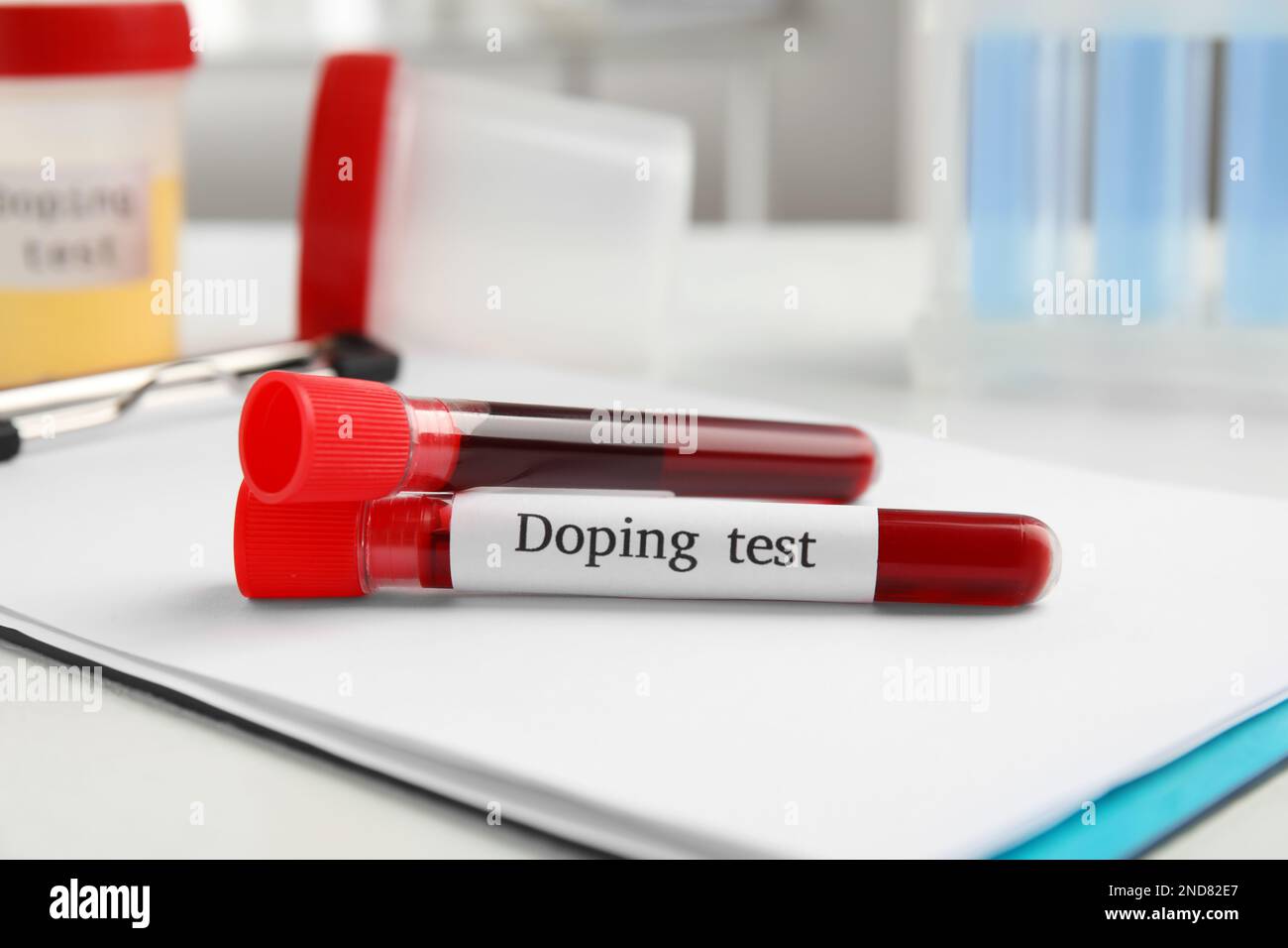 Test tubes with blood samples on white table. Doping control Stock ...