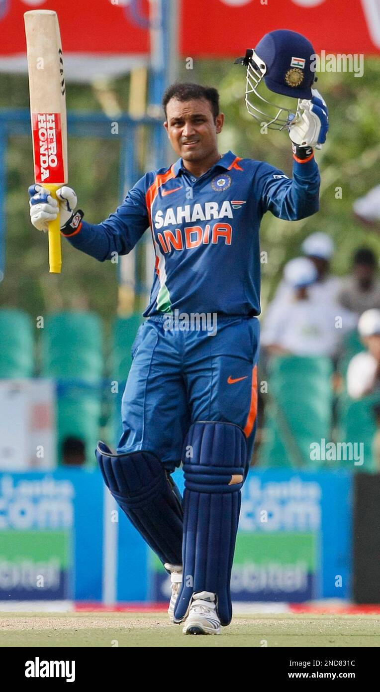 Indian cricketer Virender Sehwag celebrates his century during the tri ...
