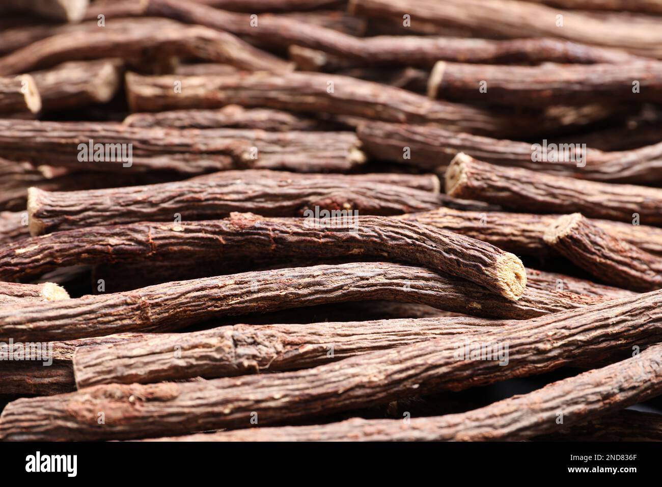 Dried sticks of liquorice root as background, closeup Stock Photo - Alamy