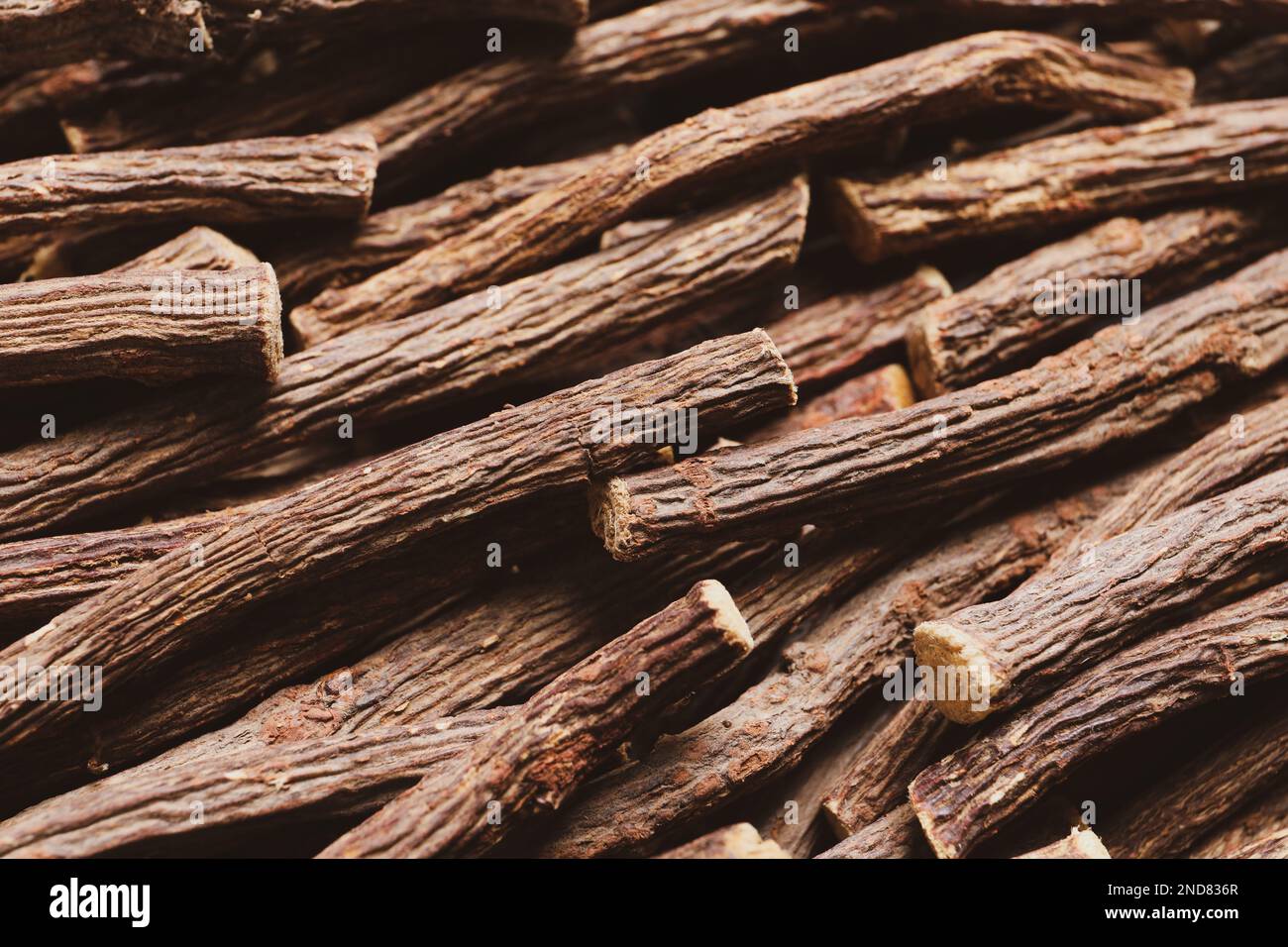 Dried sticks of liquorice root as background, closeup Stock Photo - Alamy